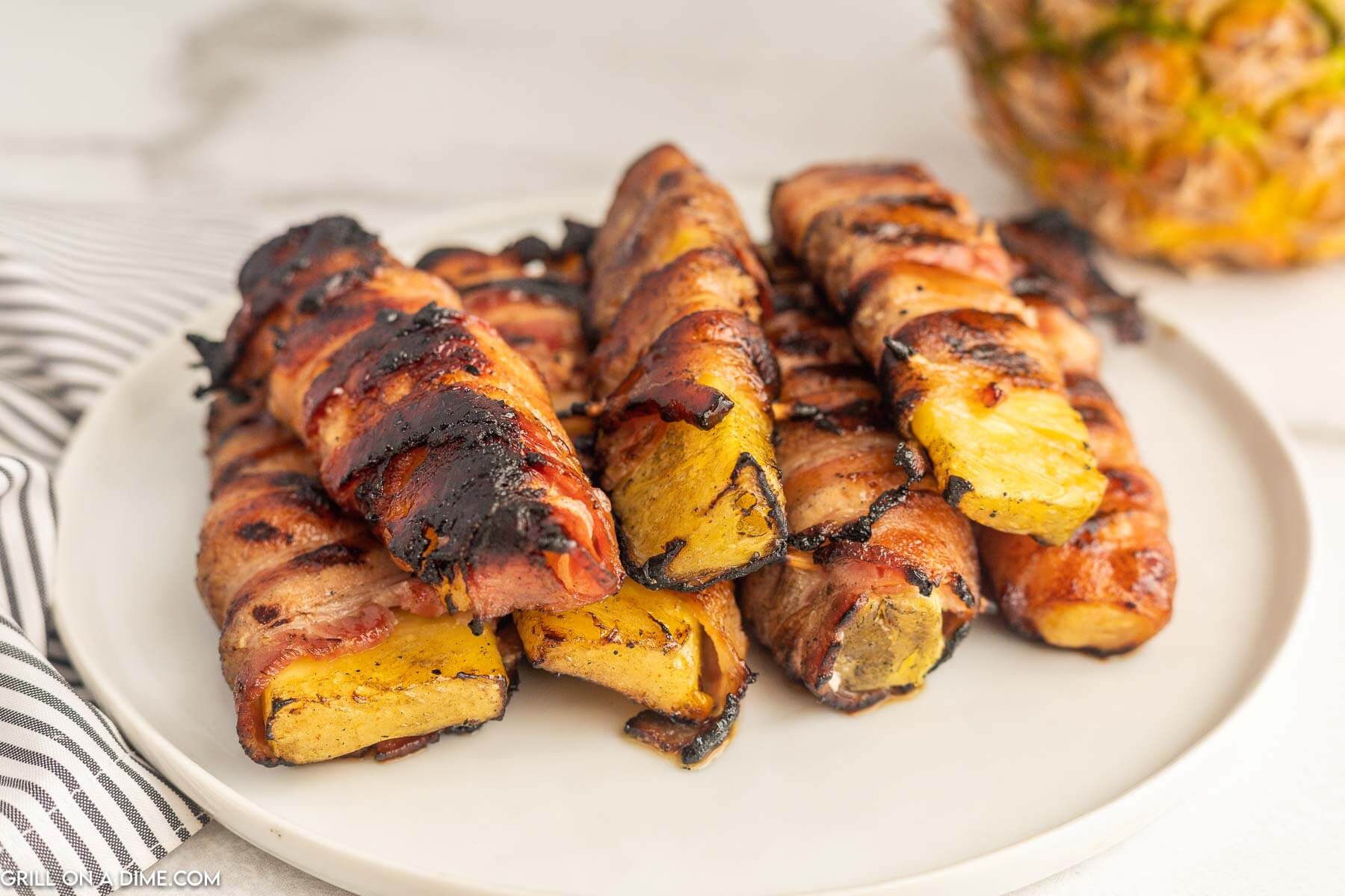 Grilled Bacon Wrapped Pineapple - grillonadime.com